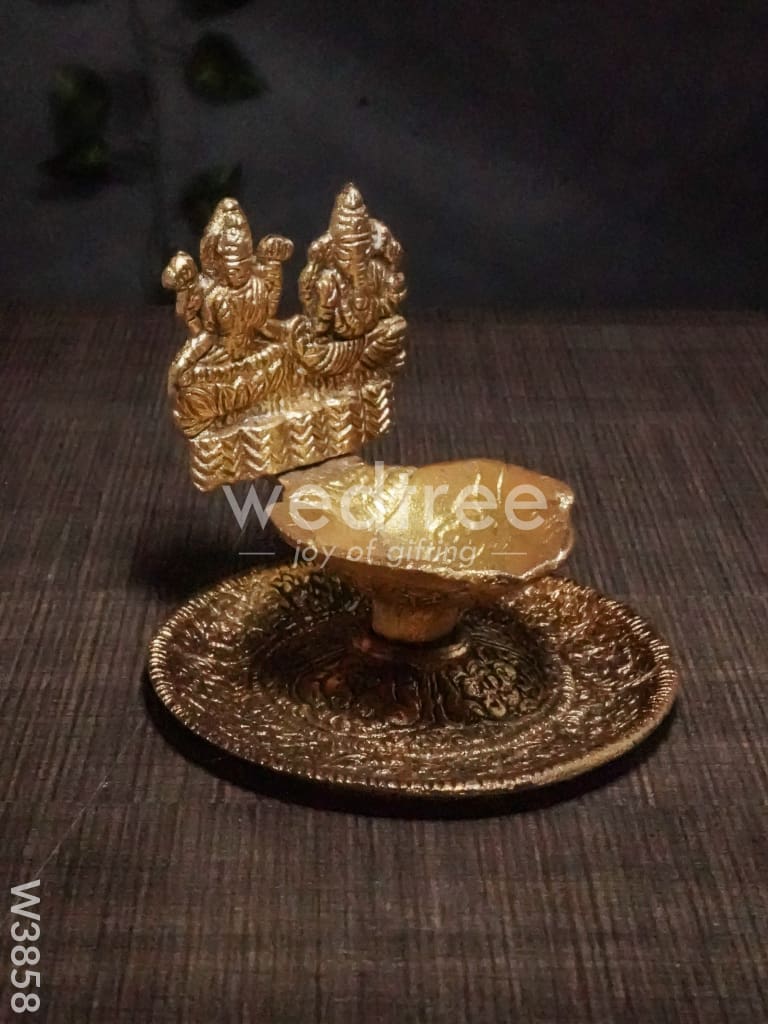 White Metal Oxidised Lakshmi Ganesh hand diya gold finish - W3858 – BLiS